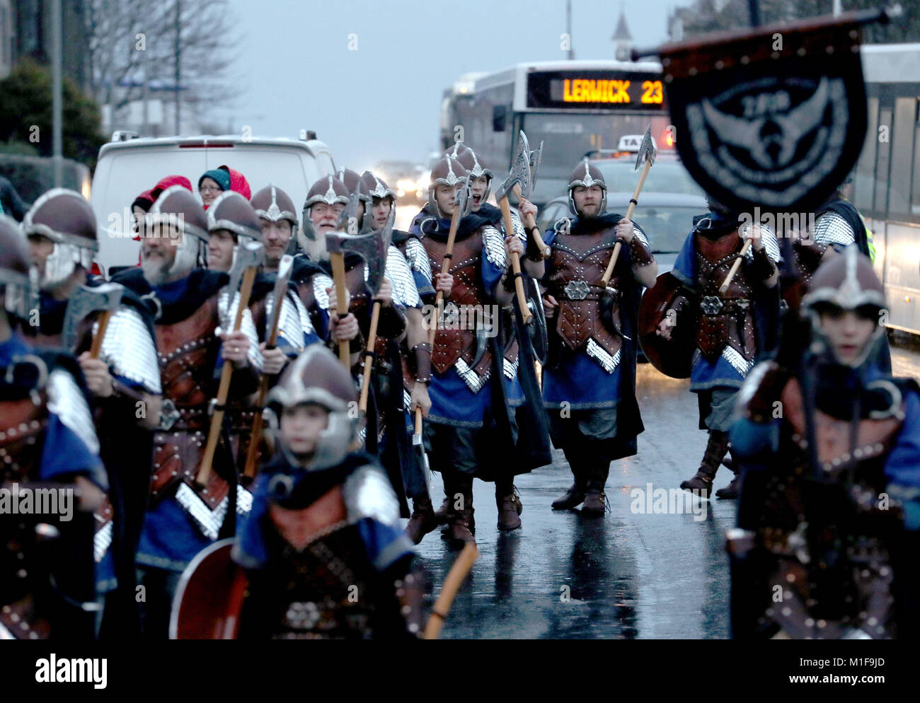 Members of the Jarl Squad dressed in Viking suits marching through the ...