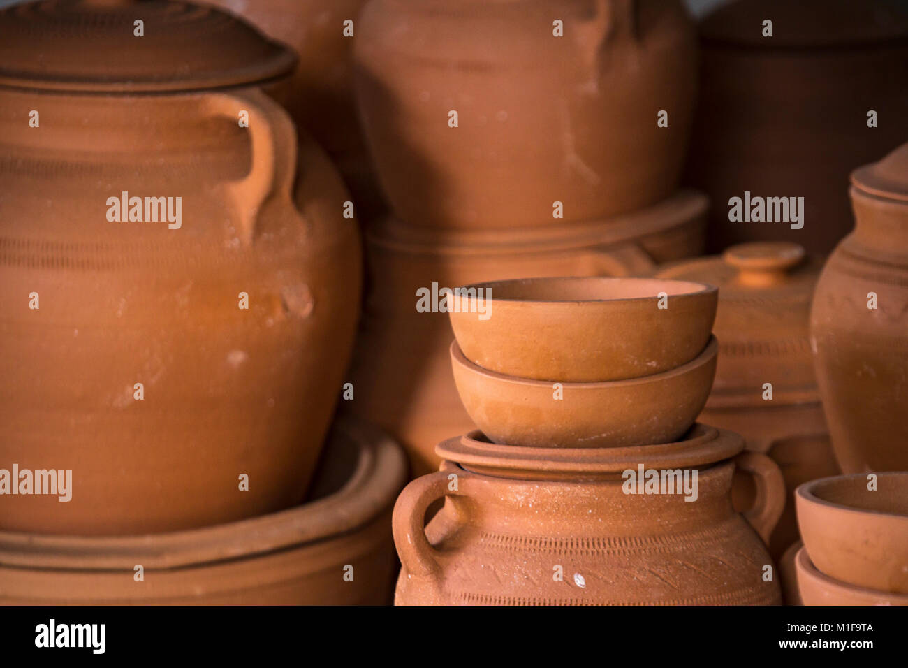 Clay pottery stacked one on another Stock Photo - Alamy