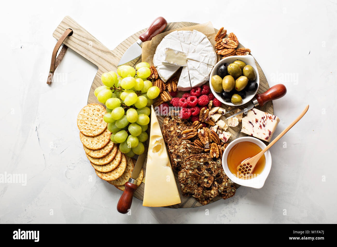 Cheese and snacks plate on white background overhead shot Stock Photo ...
