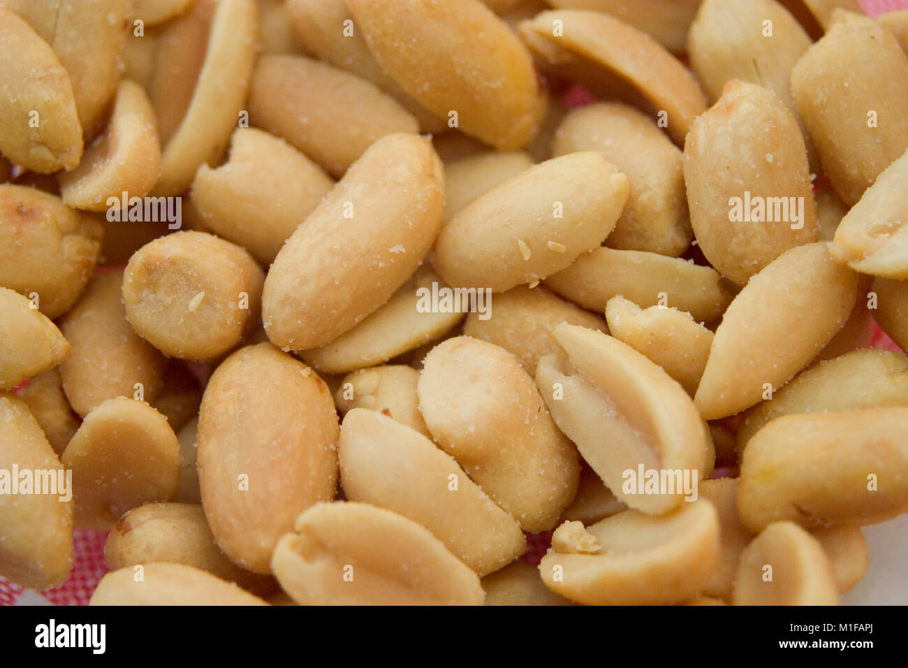 Salted peanuts full frame close up background Stock Photo - Alamy