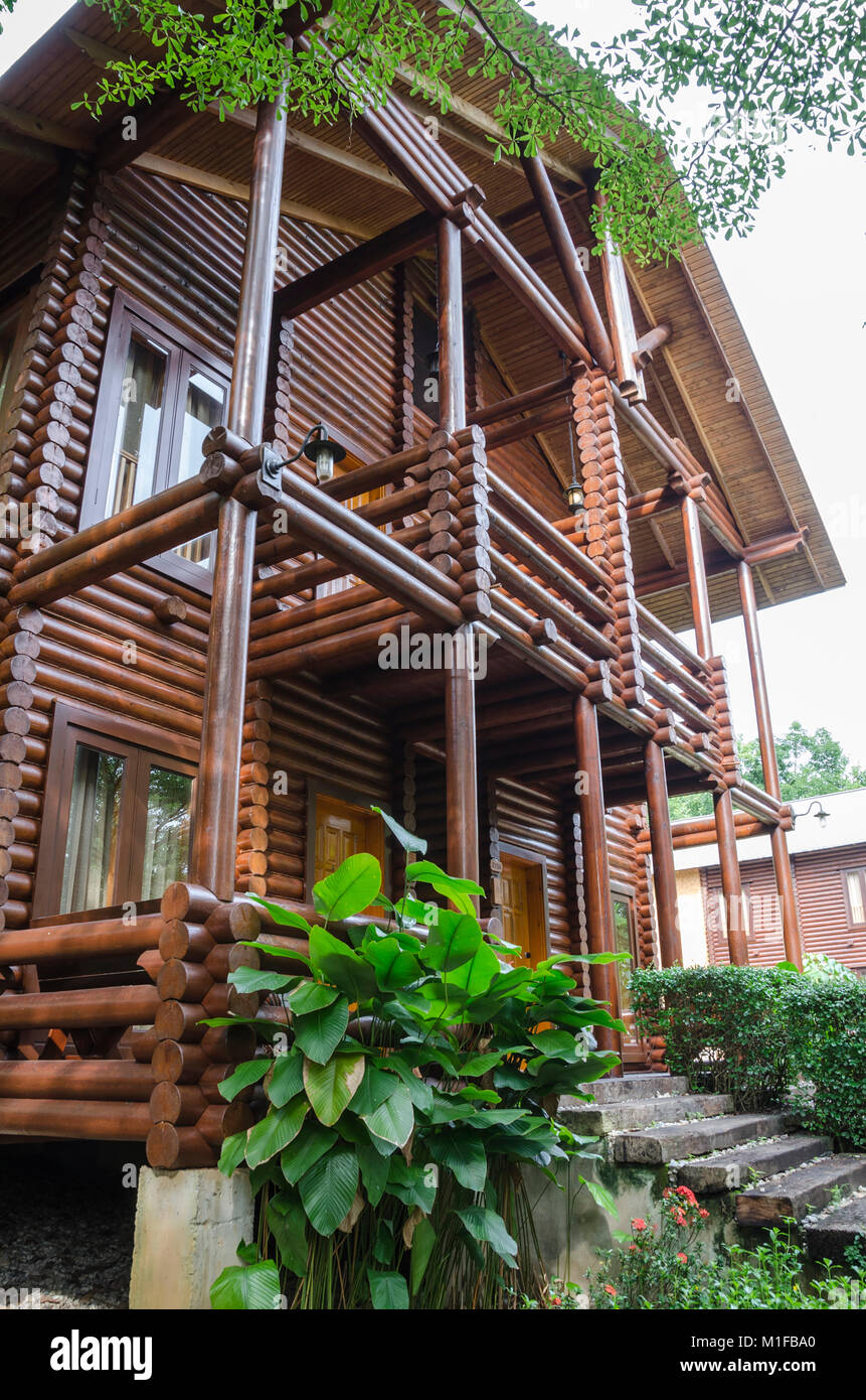 loghouse - Cozy log house amongst green environment Stock Photo - Alamy