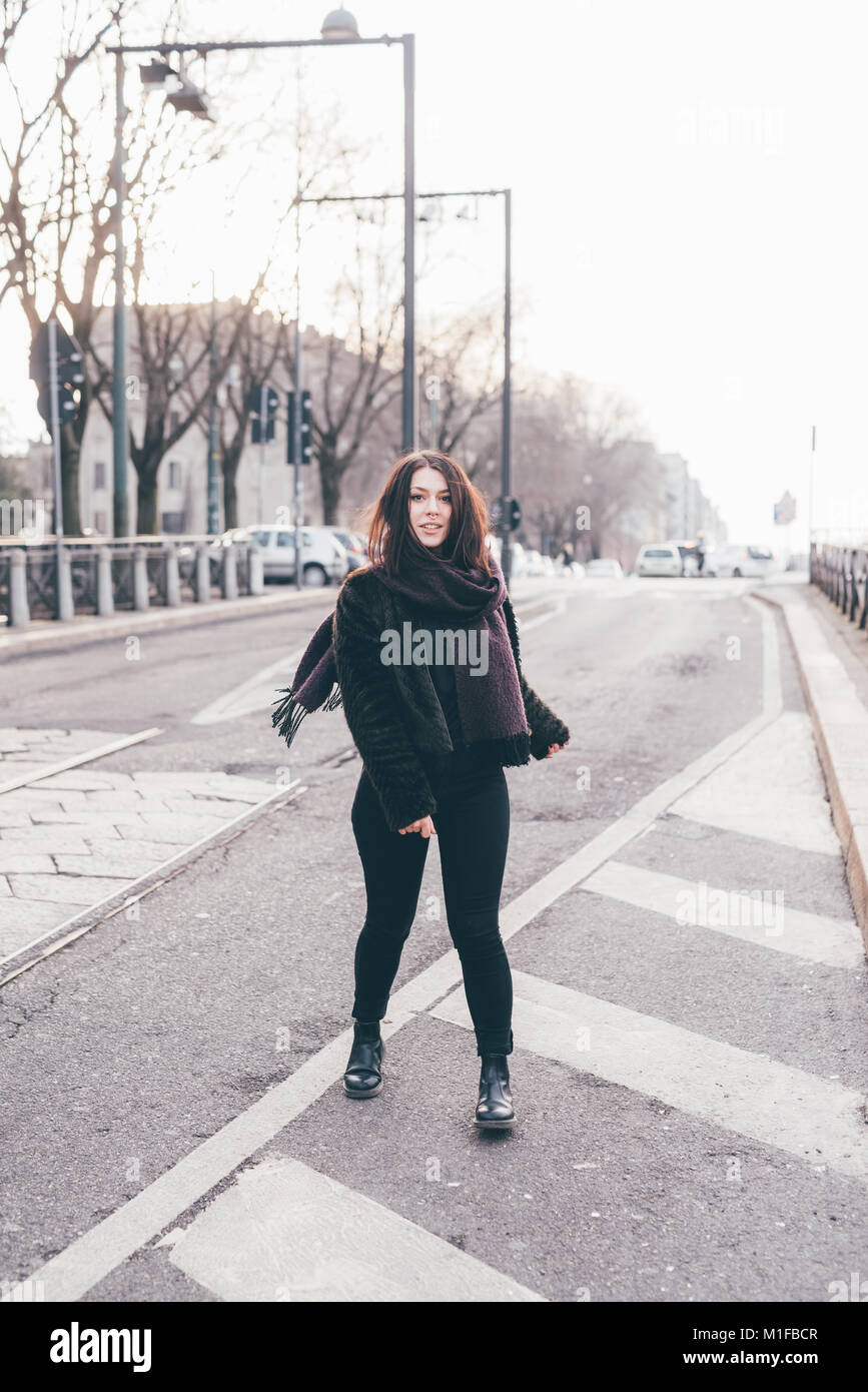 young beautiful woman walking outdoor looking camera smiling ...
