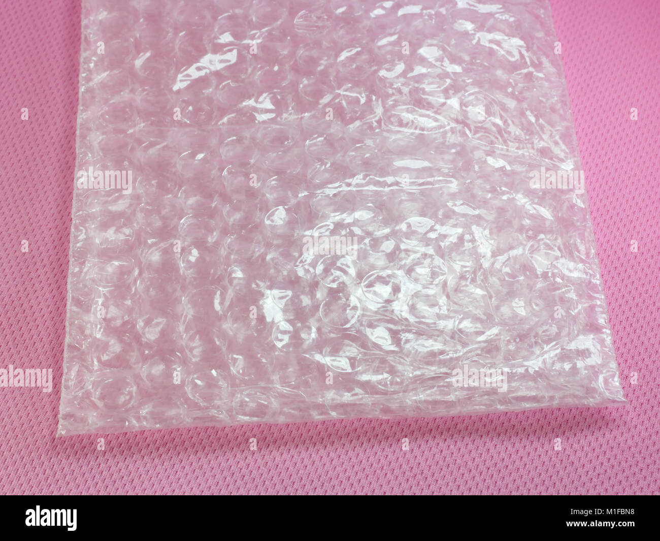 Shockproof material - Air Bubble Sheet on pink background Stock Photo ...