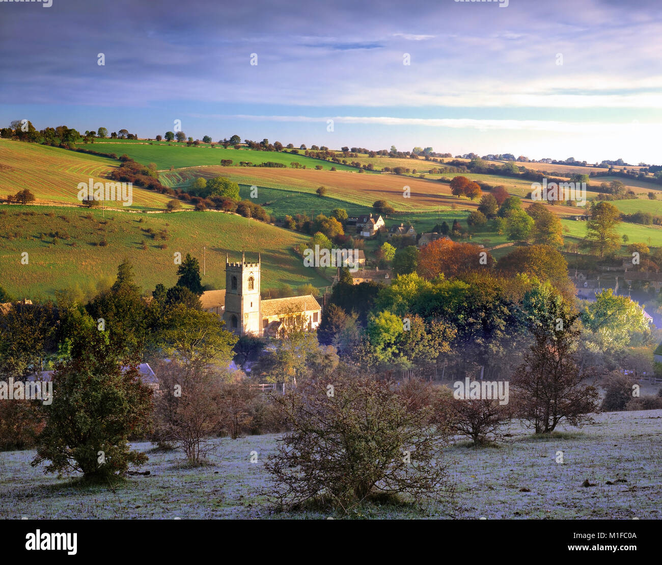 An early morning view of the Cotswolds countryside at the peak of ...