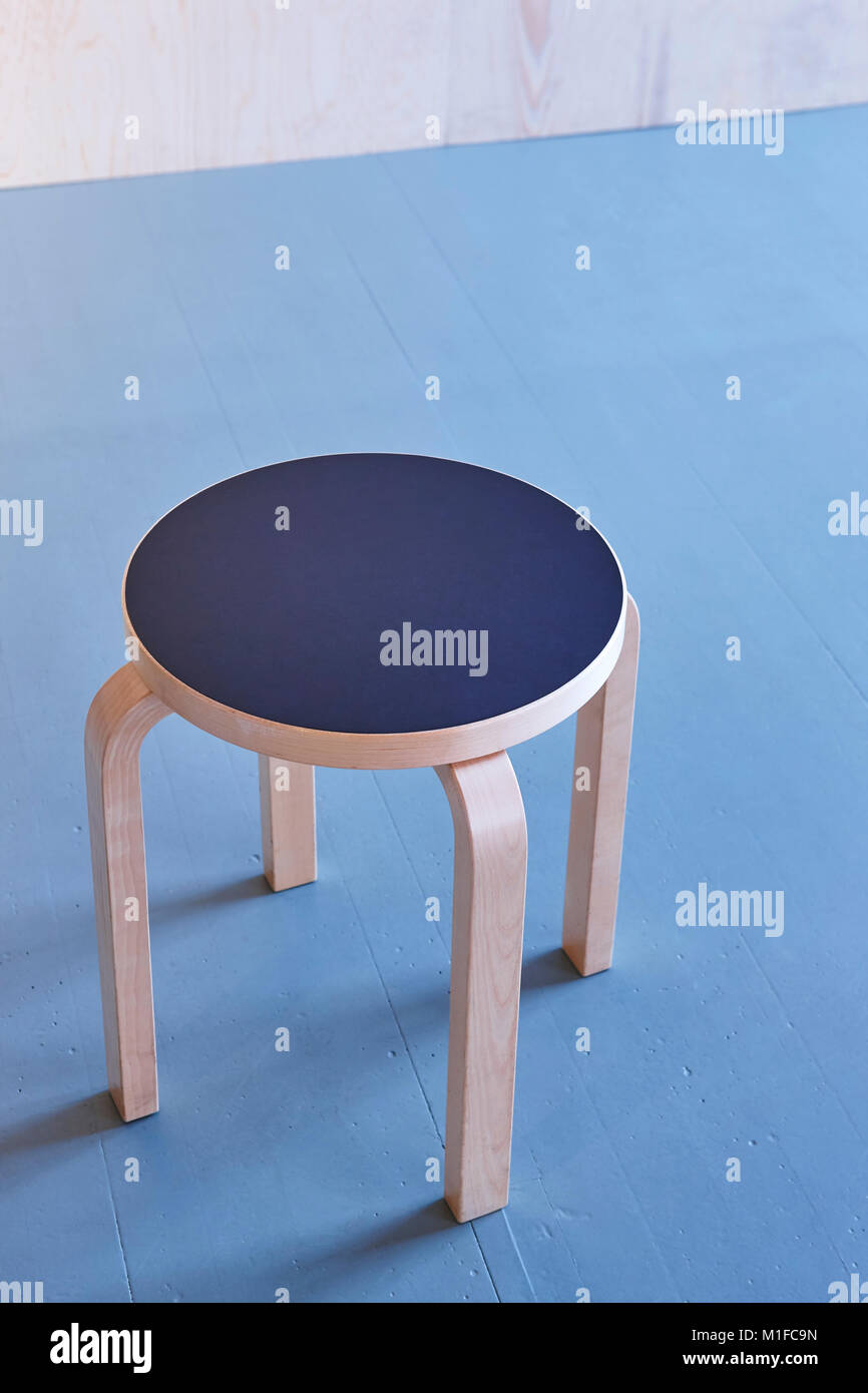 Wooden stool on an empty room. Home interior detail. Vertical Stock ...