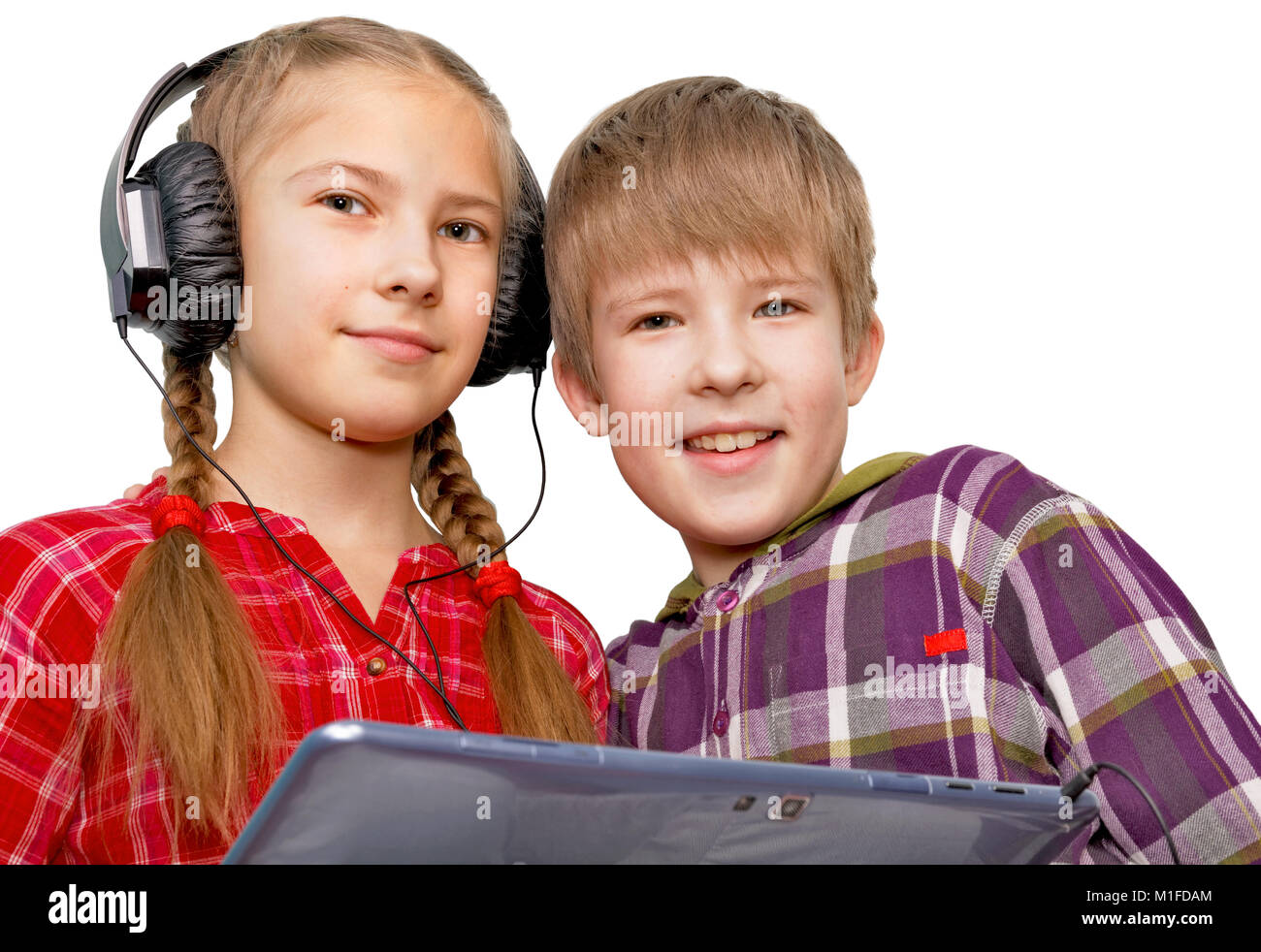 Family Fun: Brother and sister listening music on tablet PC Stock Photo ...