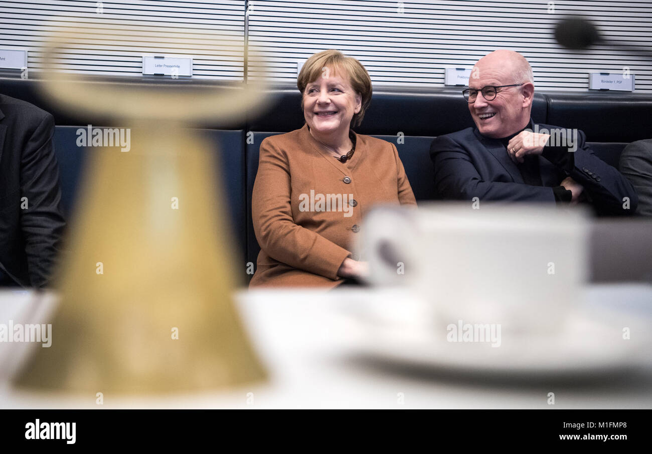 Berlin, Germany. 30th Jan, 2018. German Chancellor Angela Merkel (L) of ...