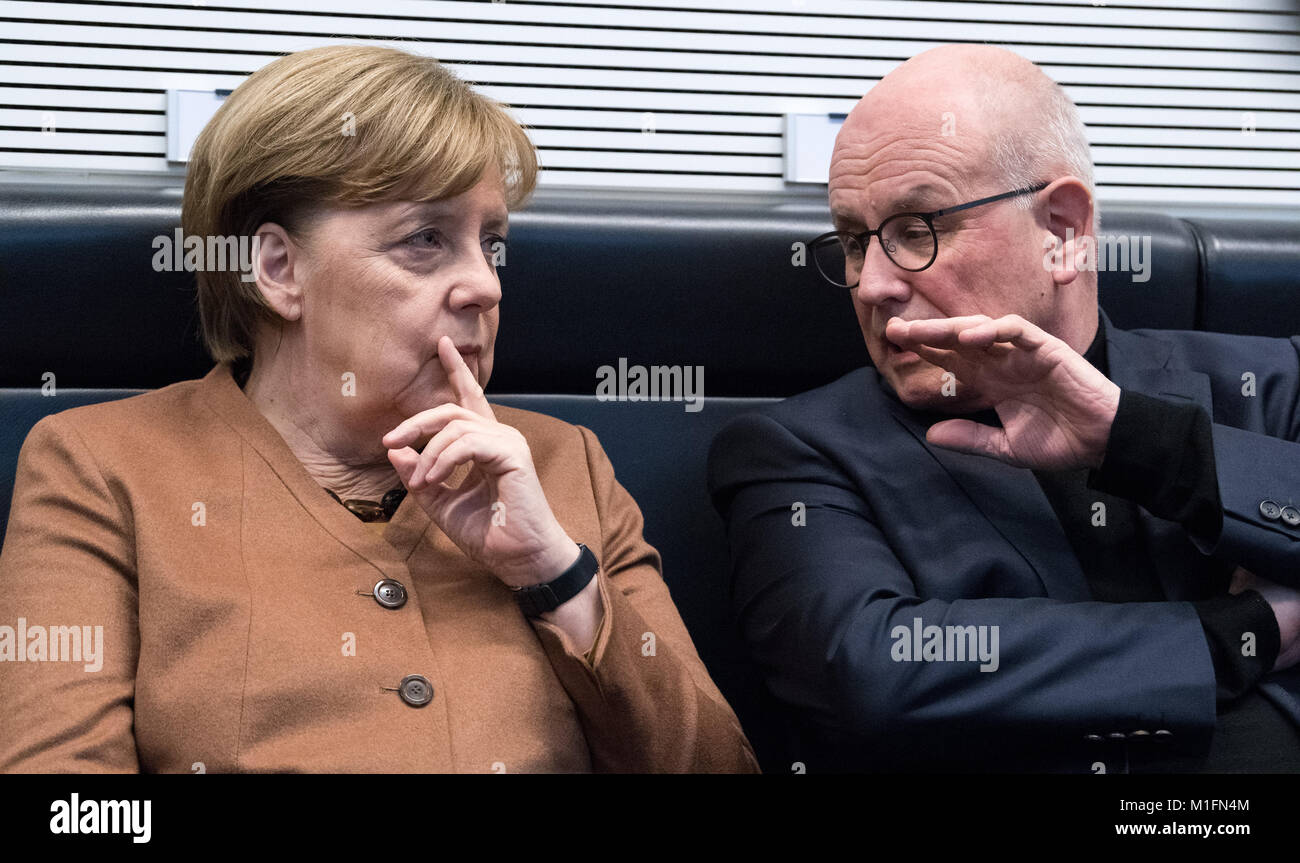 Berlin, Germany. 30th Jan, 2018. German Chancellor Angela Merkel (L) of ...
