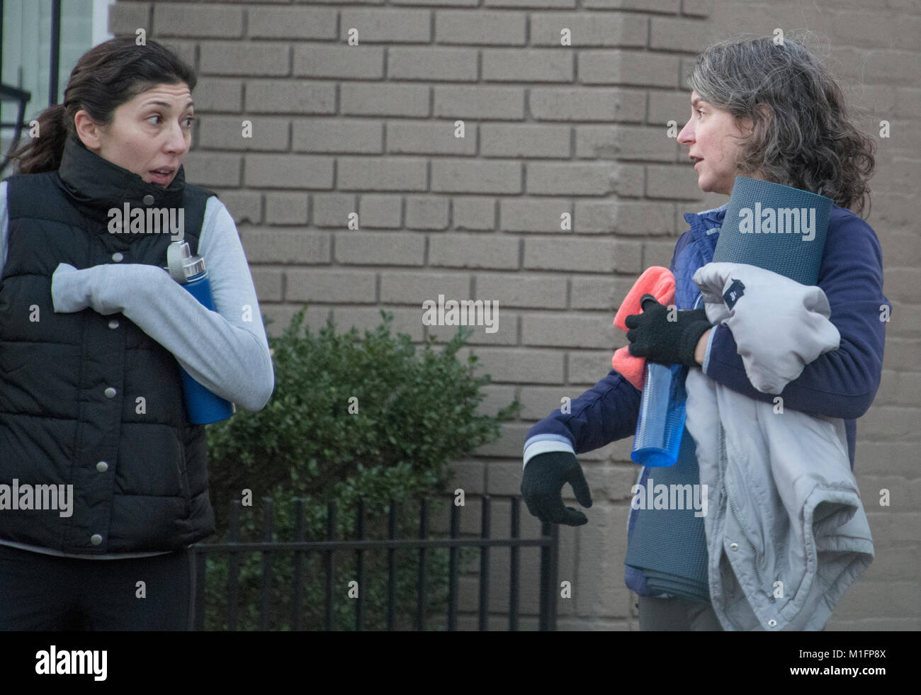 Lisa Page, left, speaks with an unidentified person outside her Capitol ...