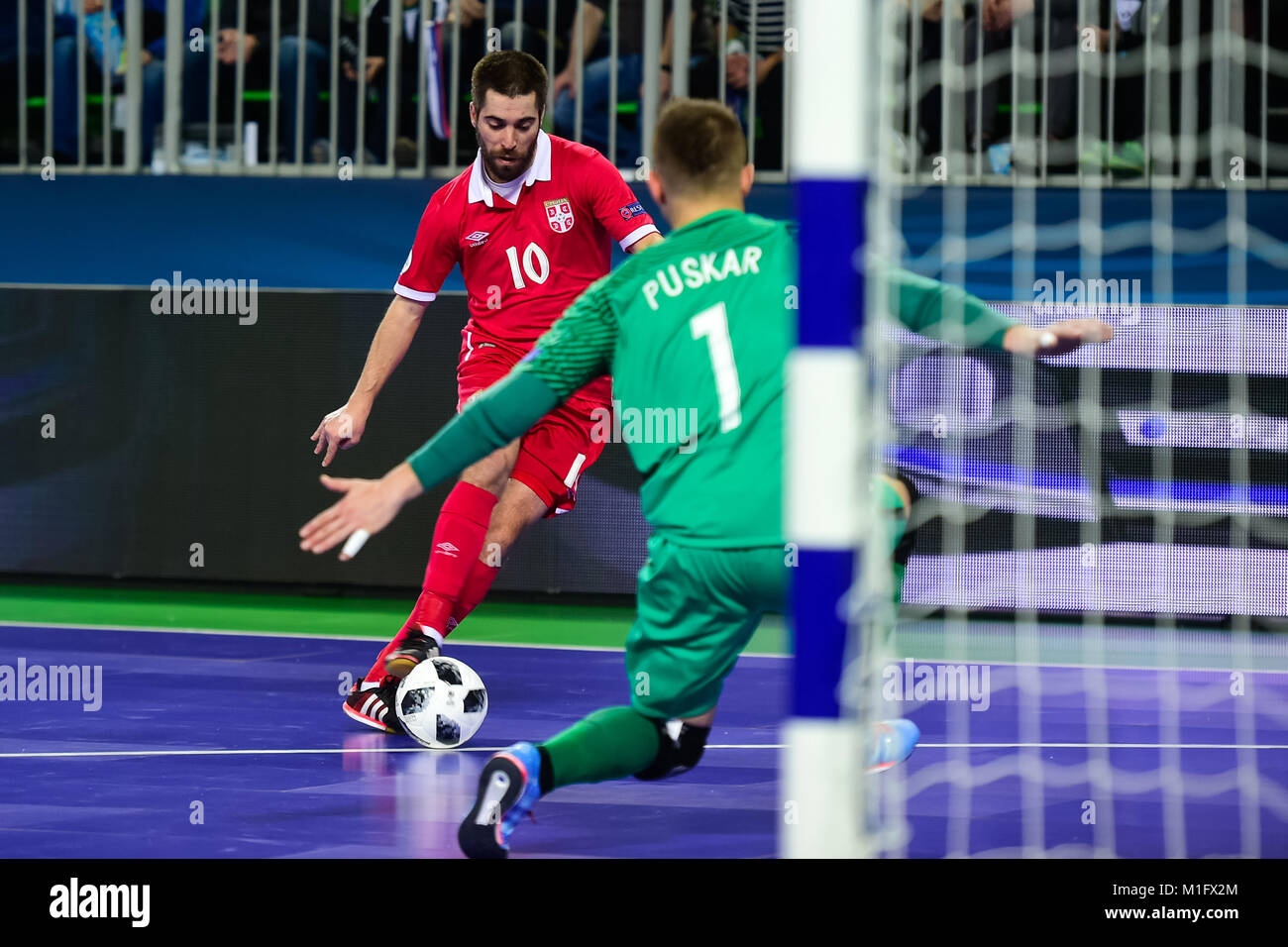 Ljubljana, Slovenia. 30th Jan, 2018. Mladen Kocic (L) of Serbia vies ...