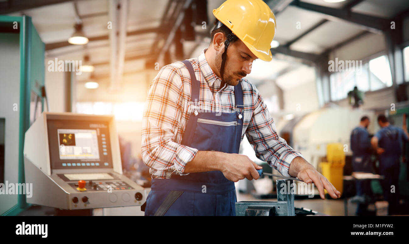 Portrait of an handsome engineer in a factory Stock Photo - Alamy
