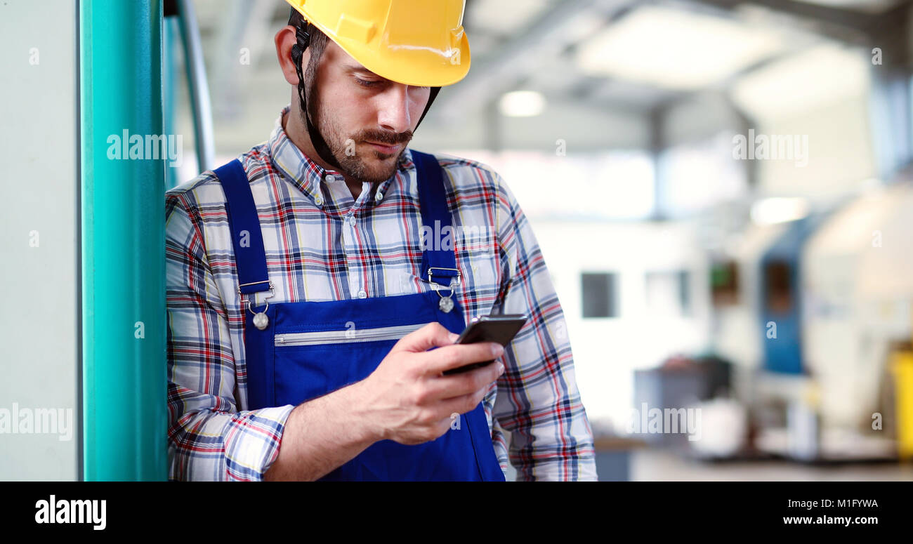 Portrait of an handsome engineer in a factory Stock Photo - Alamy