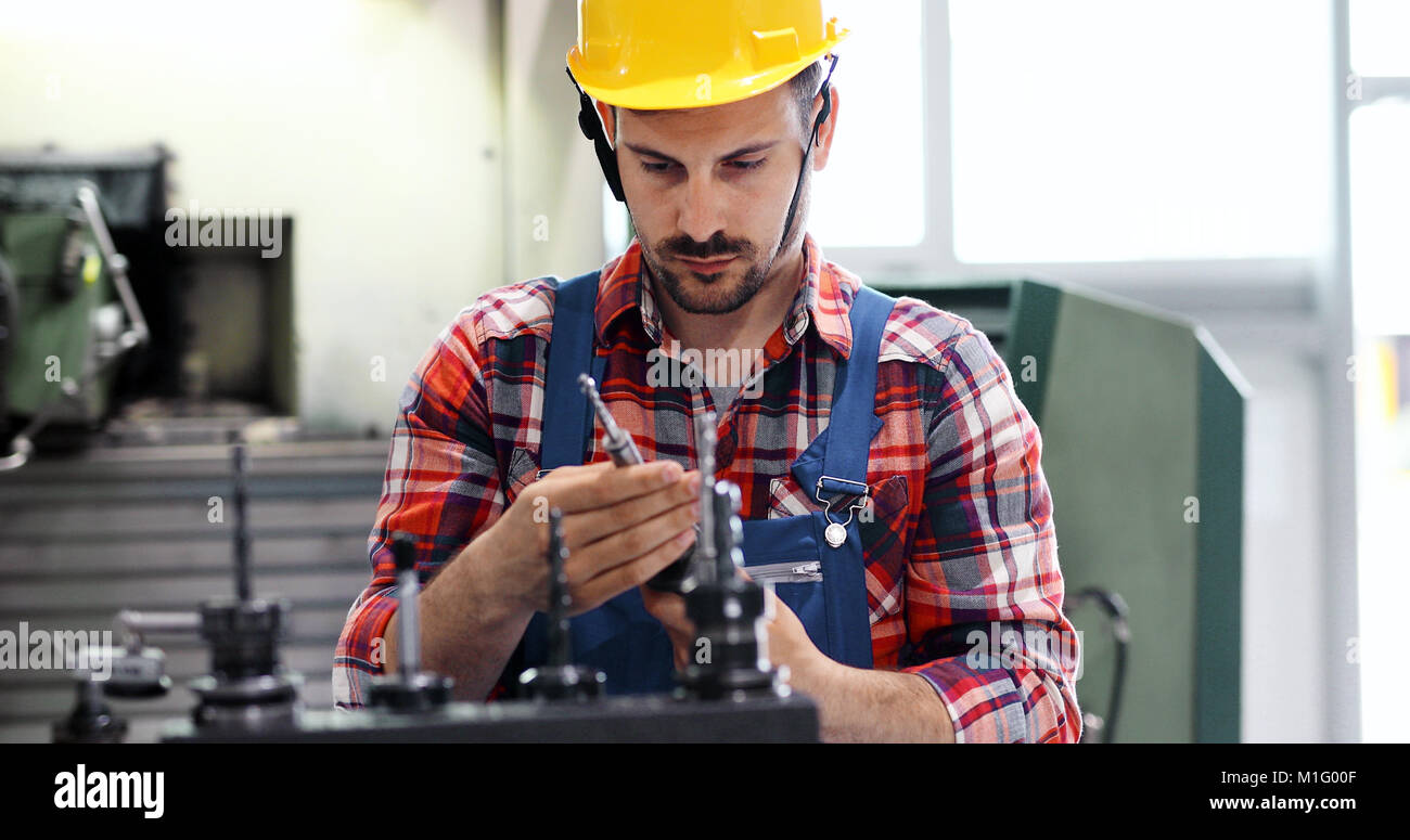 Portrait of an handsome engineer in a factory Stock Photo - Alamy