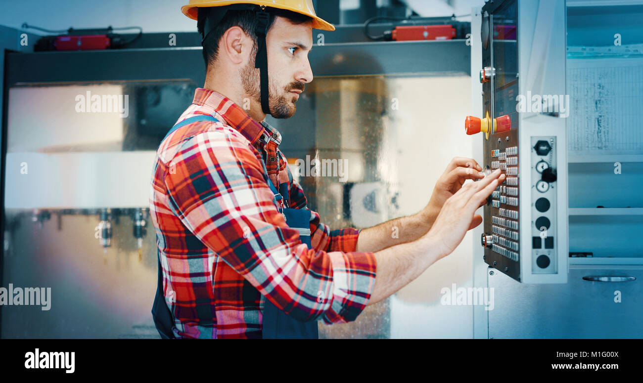 modern industrial machine operator working in factory Stock Photo - Alamy