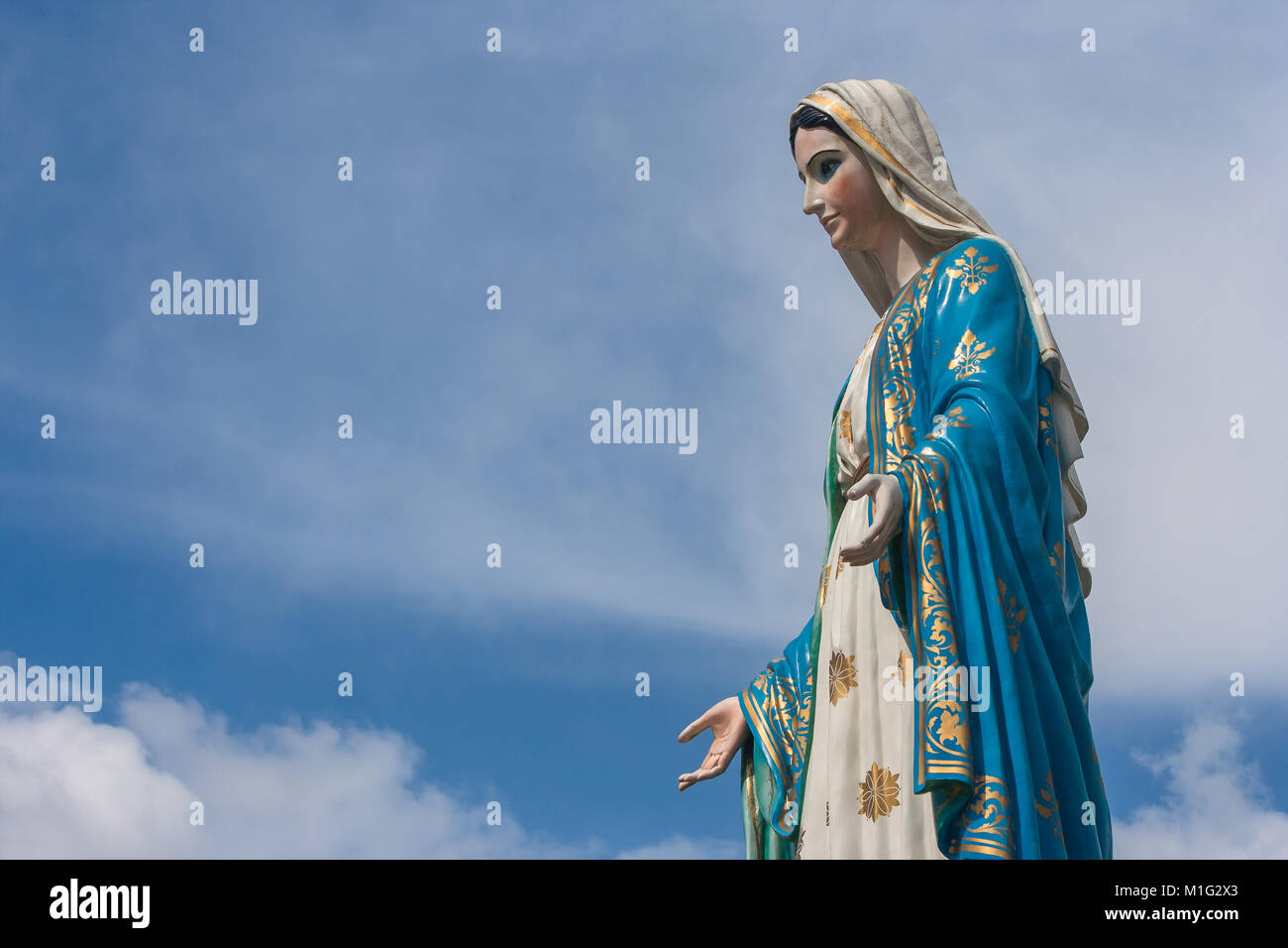 The Blessed Virgin Mary statue standing in front of The Cathedral of ...