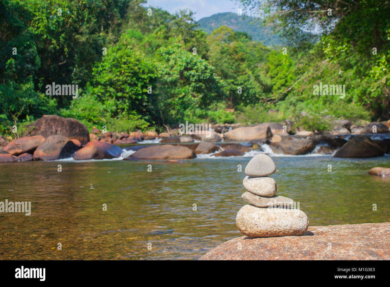 Close up pile of pebbles with beautiful landscape view of small ...