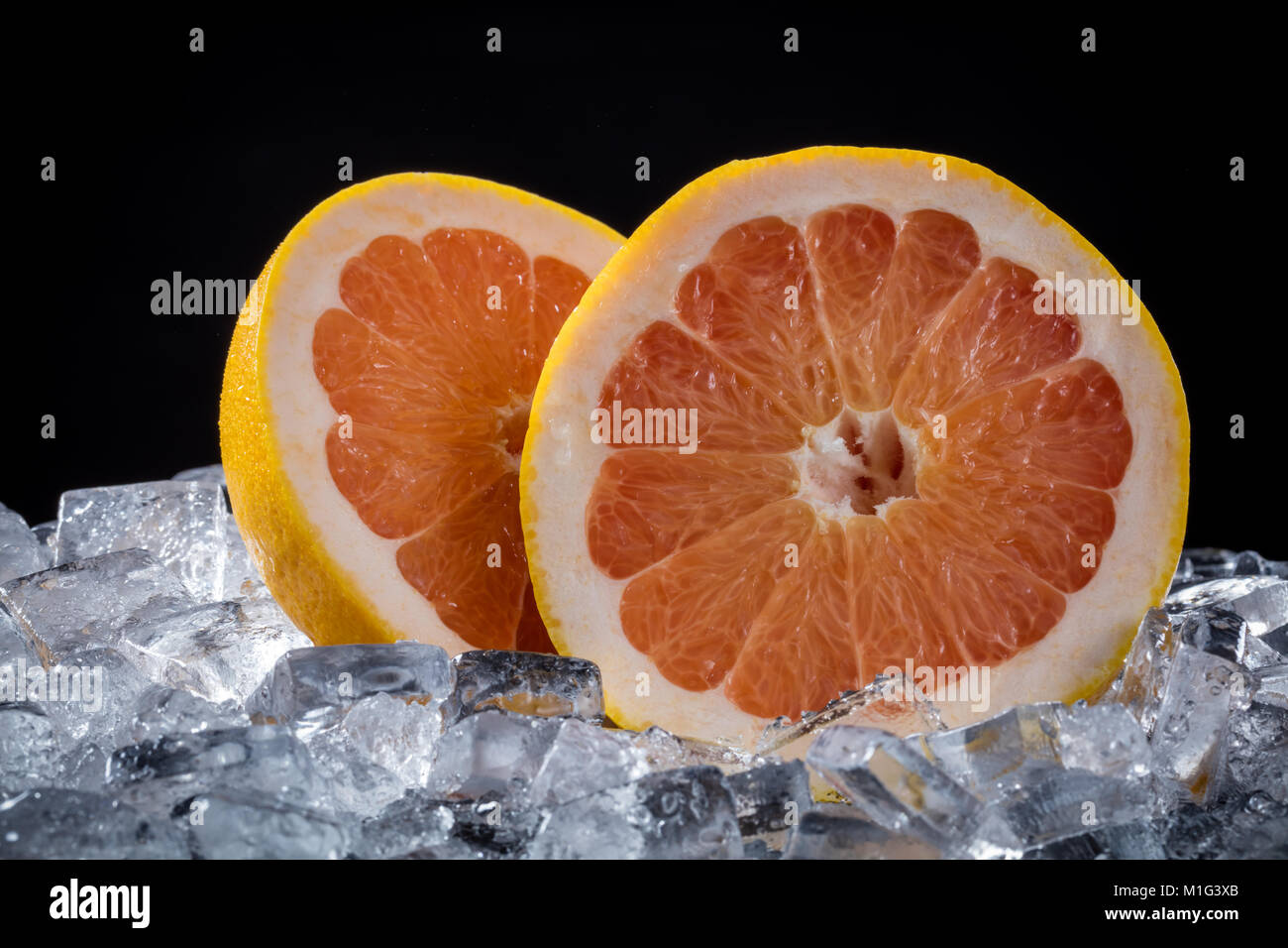 Orange with ice Stock Photo - Alamy
