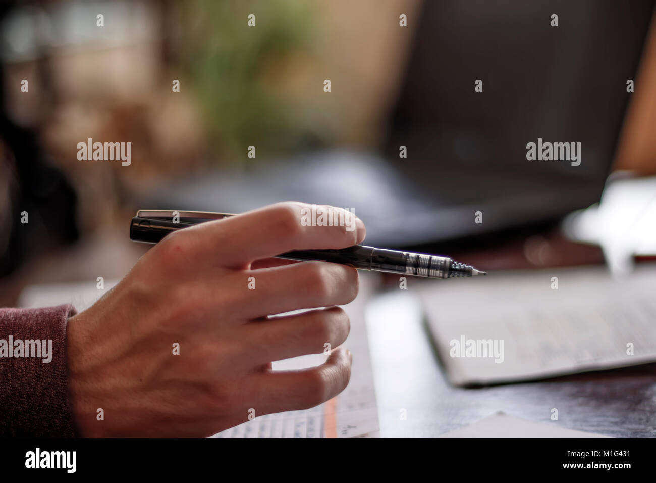 Hand of a man with a pen Stock Photo - Alamy