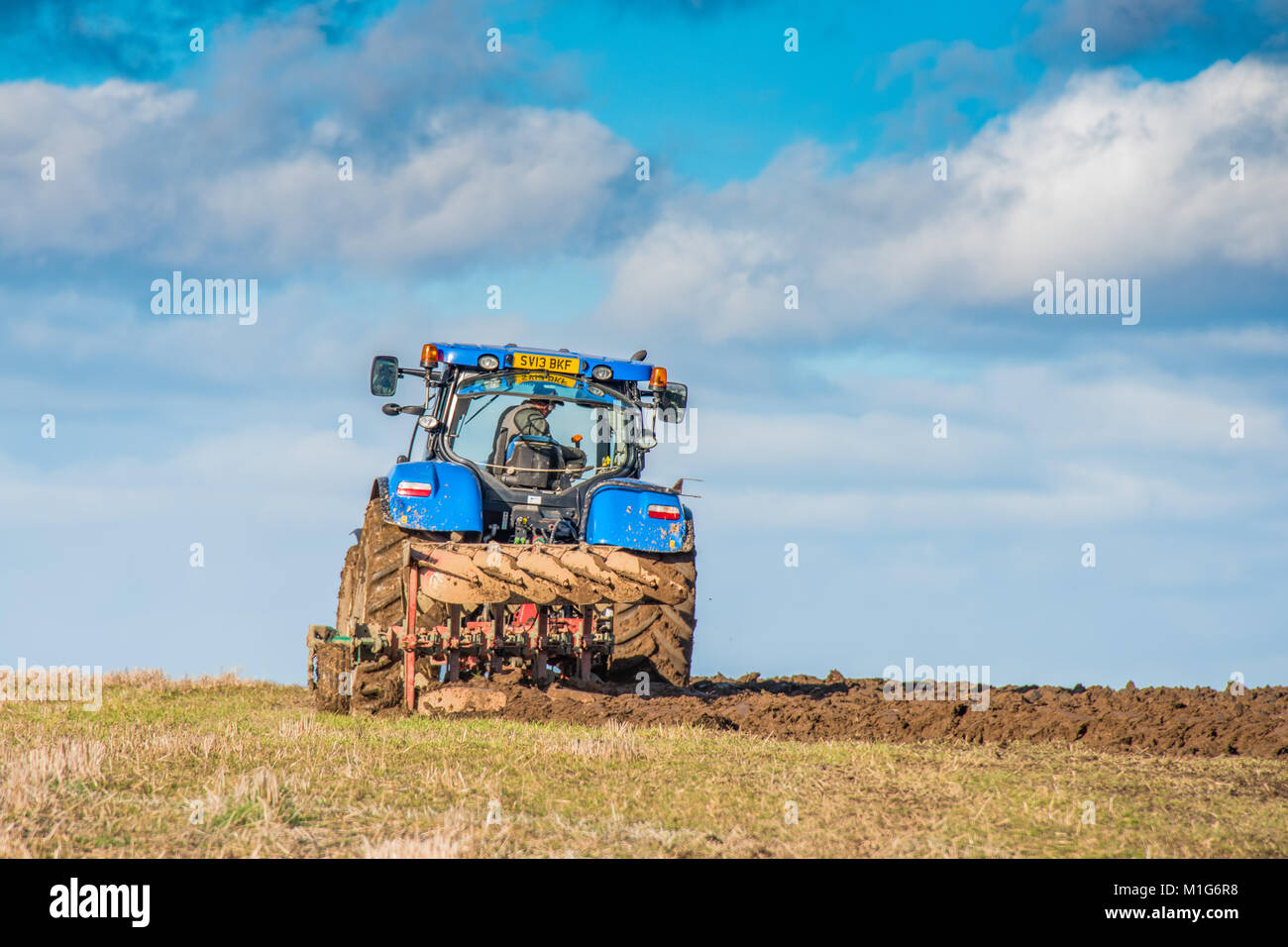 A tractor ploughing on the Haddo Estate in rural Aberdeenshire ...