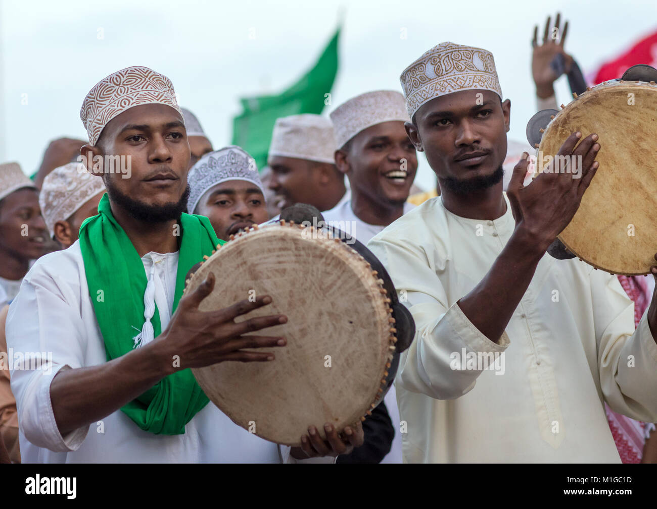 Sunni muslim men playing tambourines during the Maulidi festivities in ...