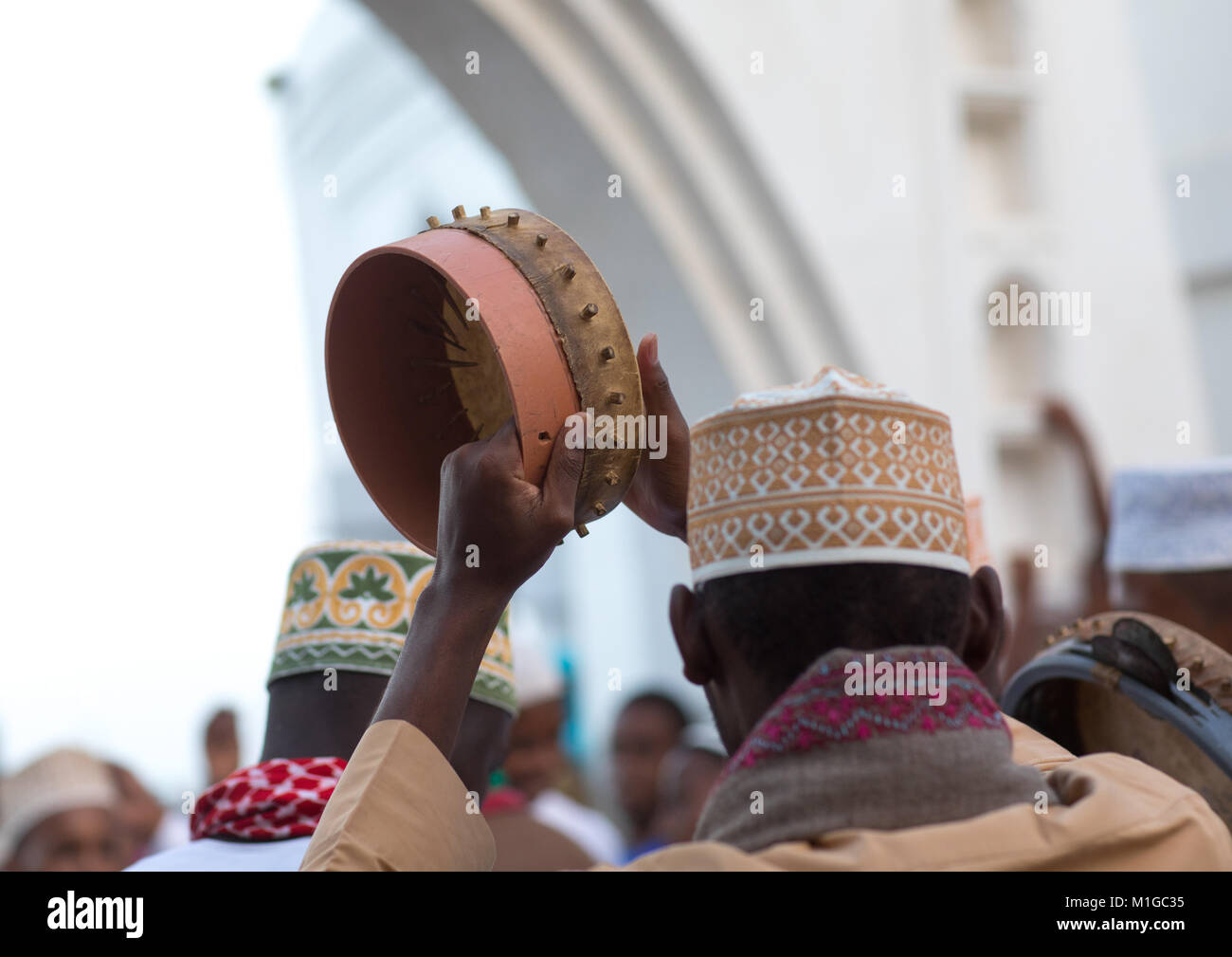 Sunni muslim men playing tambourines during the Maulidi festivities in ...