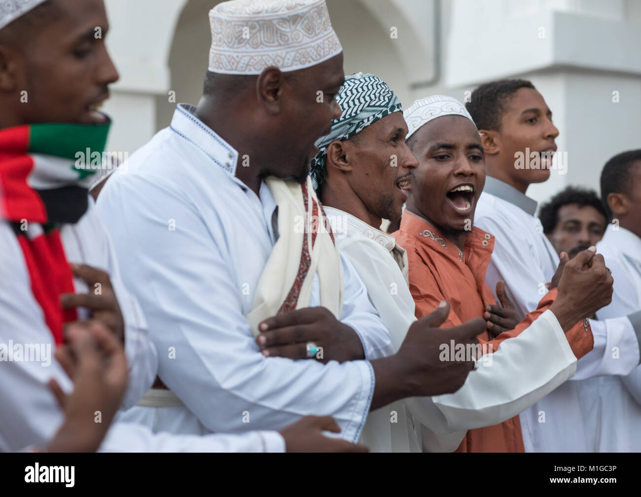 Sunni muslim men dancing during the Maulidi festivities in the street ...
