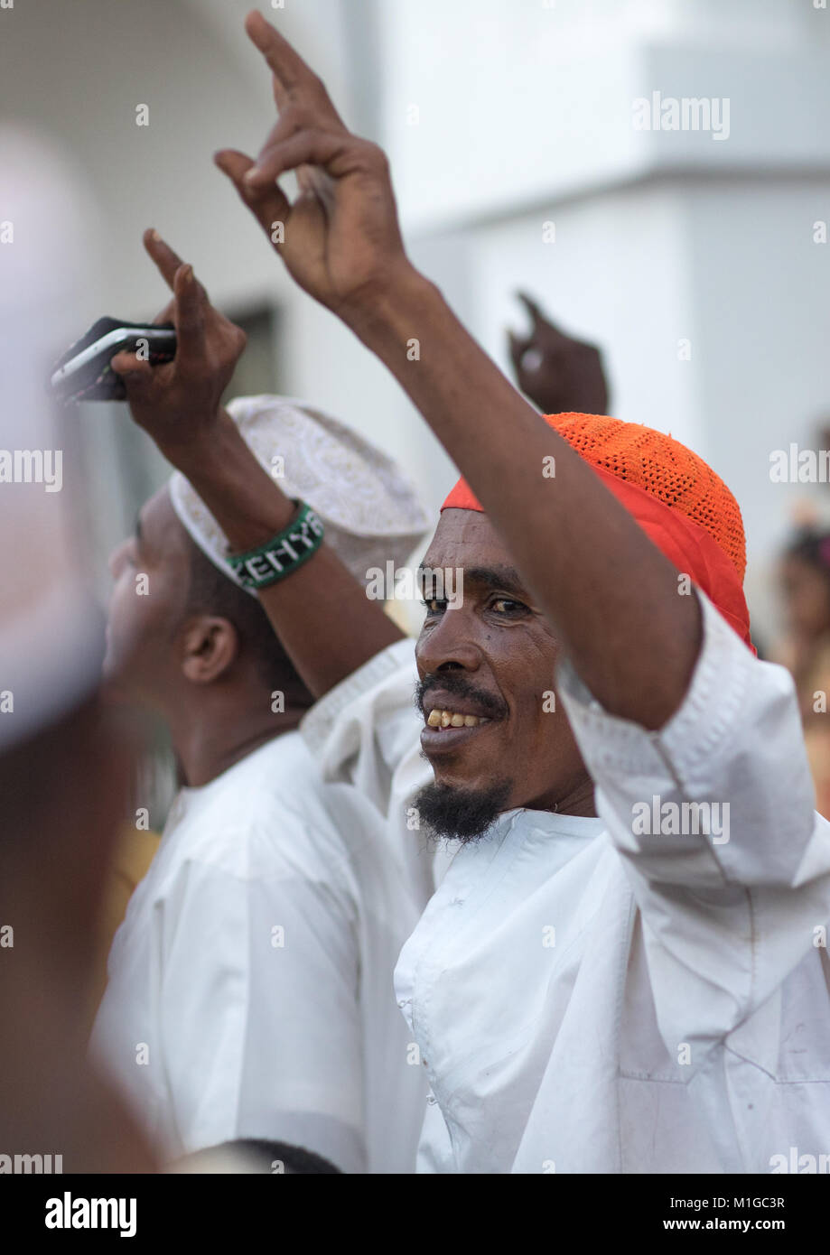 Sunni muslim men celebrating the Maulidi festivities in the street ...