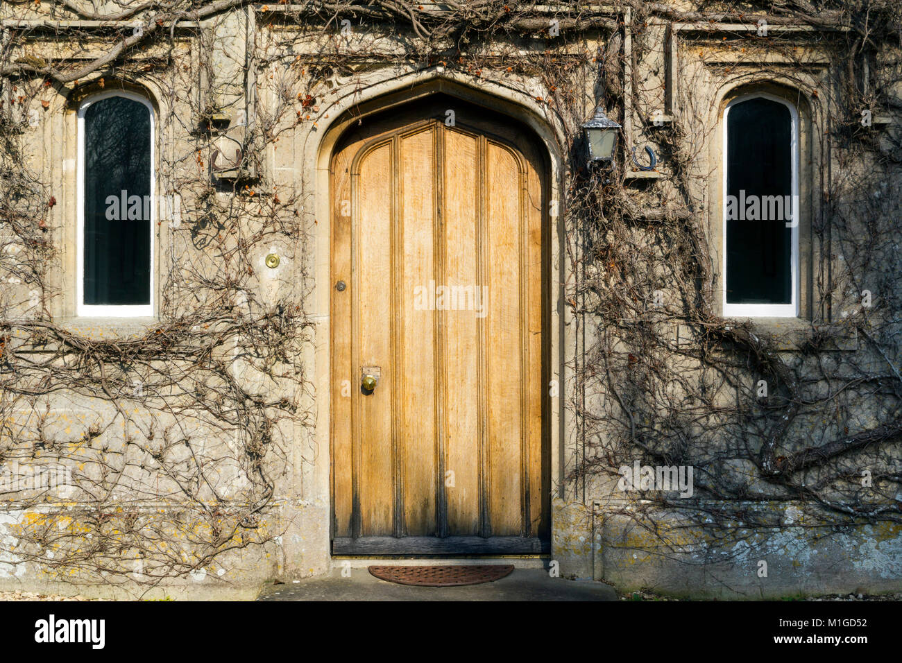 Classical style front door with a window each side Stock Photo - Alamy