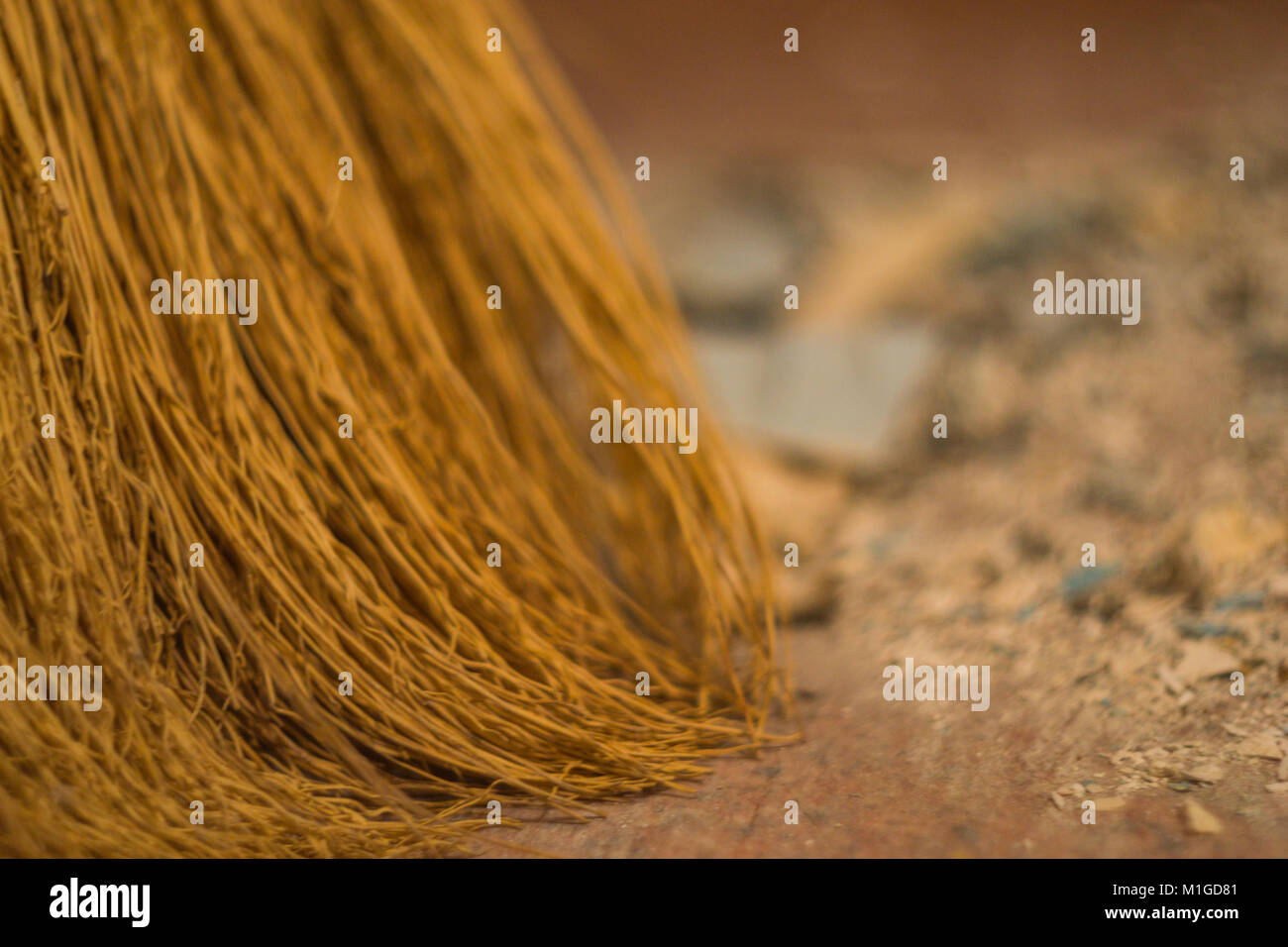 cleaning of construction debris after repair broom Stock Photo - Alamy