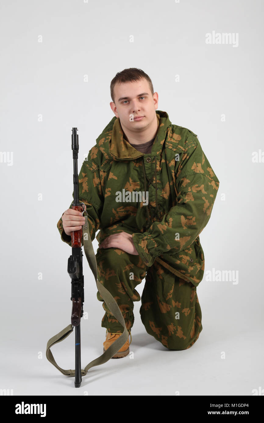 Russian soldier in camouflage with gun Stock Photo - Alamy