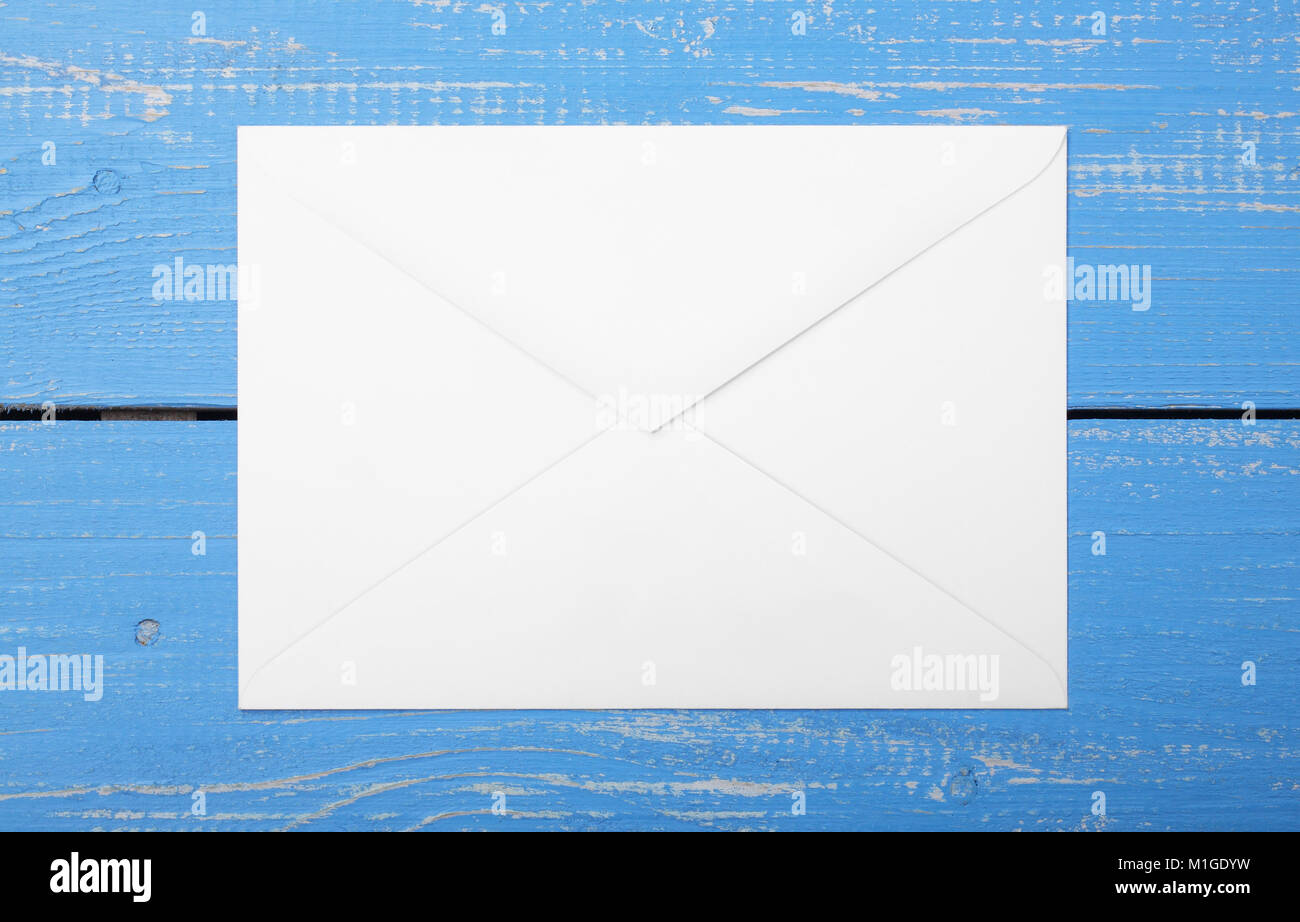 Postage and packing service - Envelope on a blue wood plank background ...