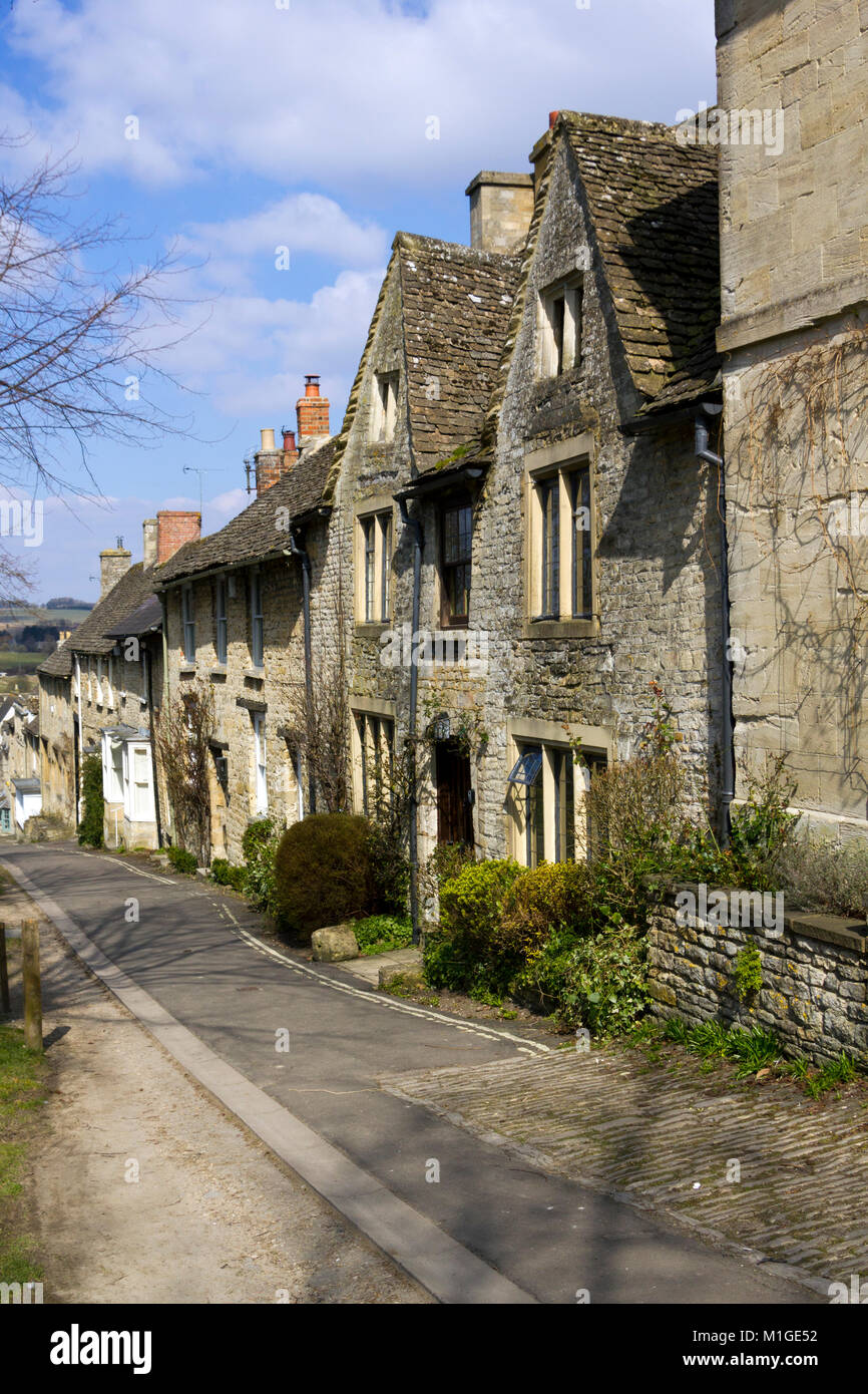 Quaint Cotswold cottages in early spring sunshine on The Hill, Burford ...