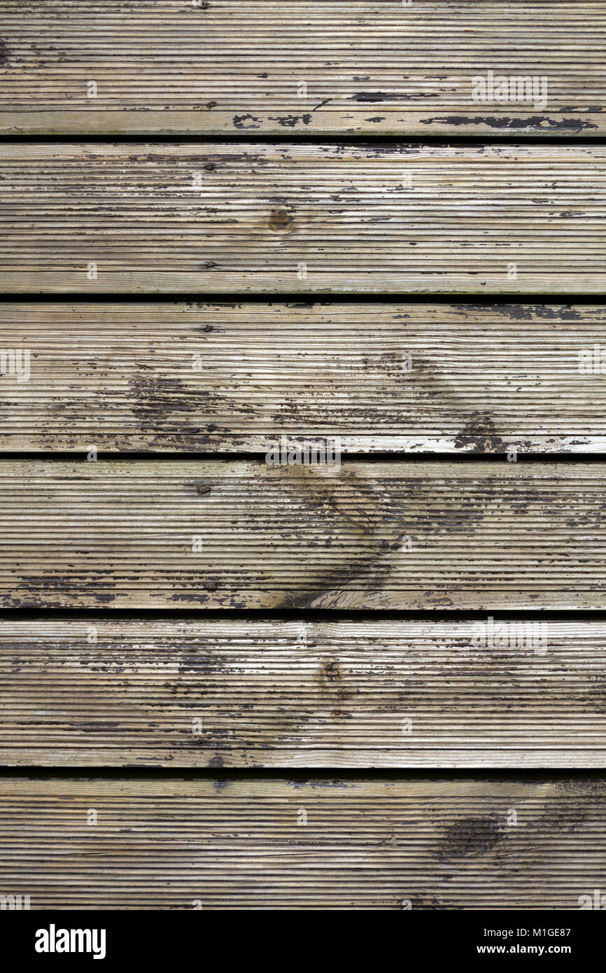 Distressed old decking boards in need of treatment Stock Photo - Alamy