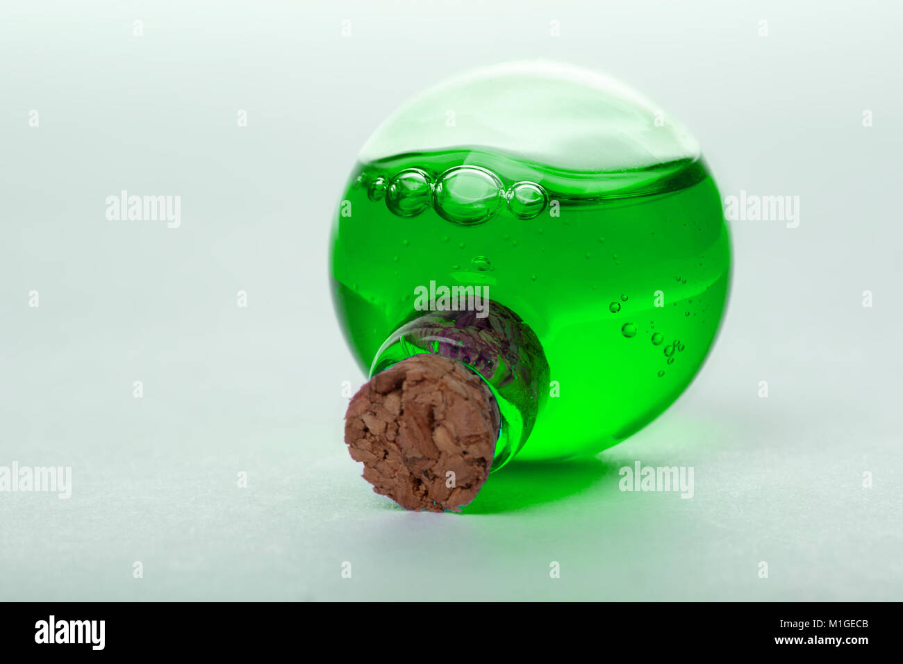 green liquid in old style vial. close up Stock Photo - Alamy