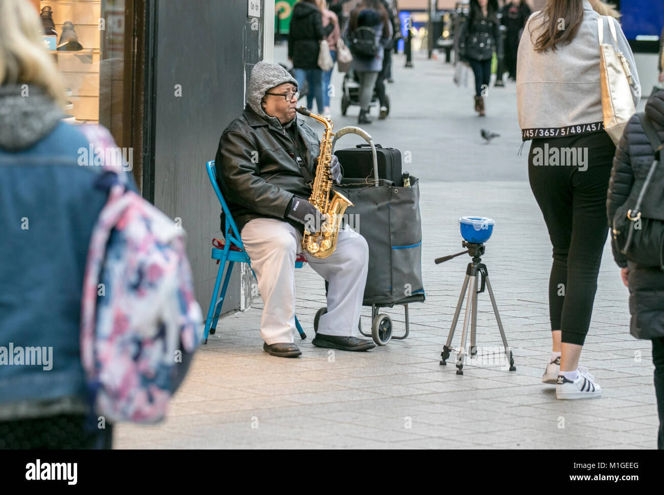 Busker playing alto saxophone hi-res stock photography and images - Alamy