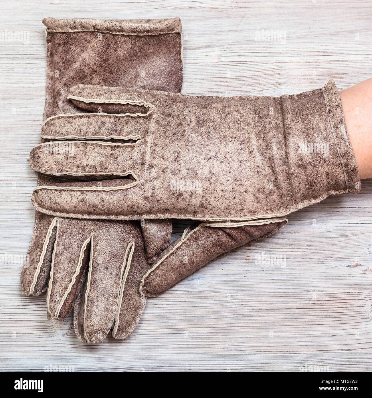 workshop on sewing gloves - top view of hand in new hand-made glove on ...