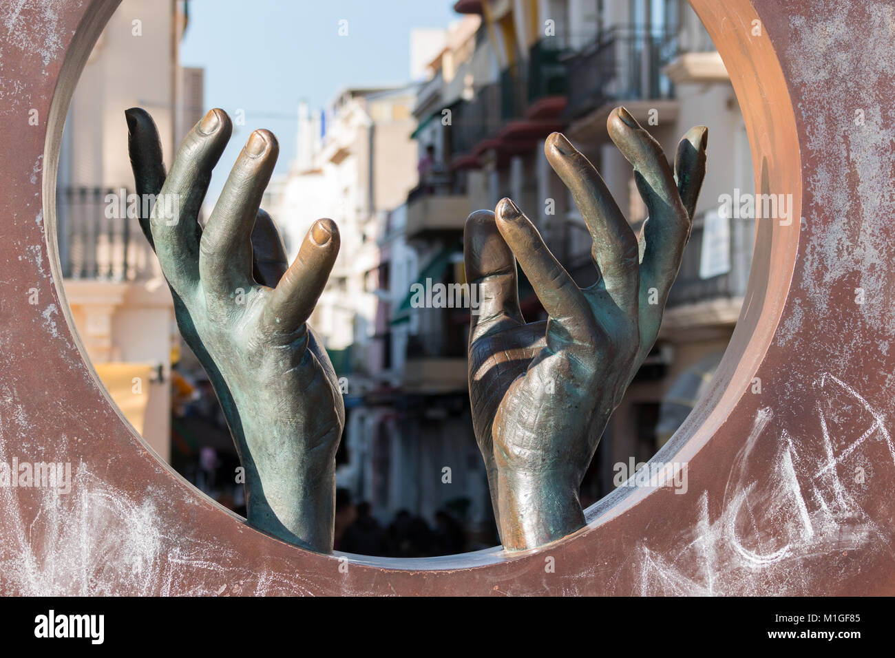 Sculpture of green hands in Sitges, in Spain Stock Photo - Alamy