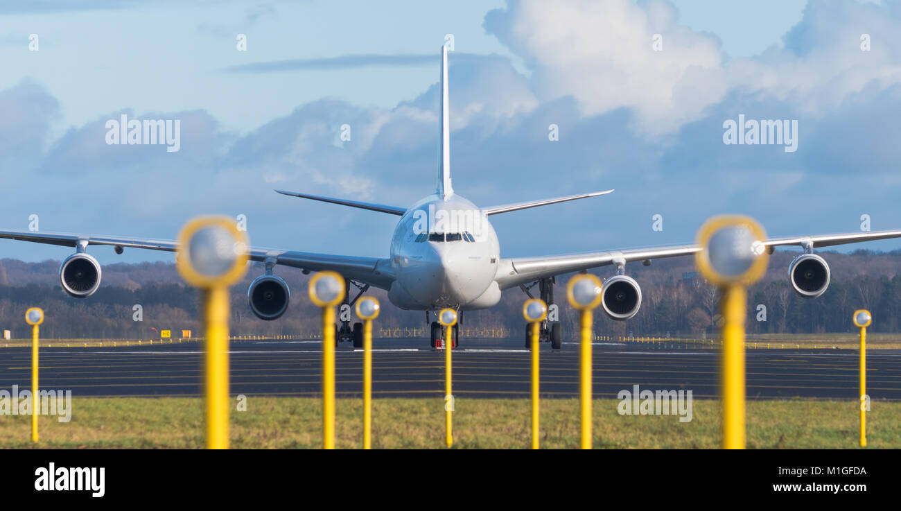 white airbus A340-300 at the end of the runway Stock Photo - Alamy