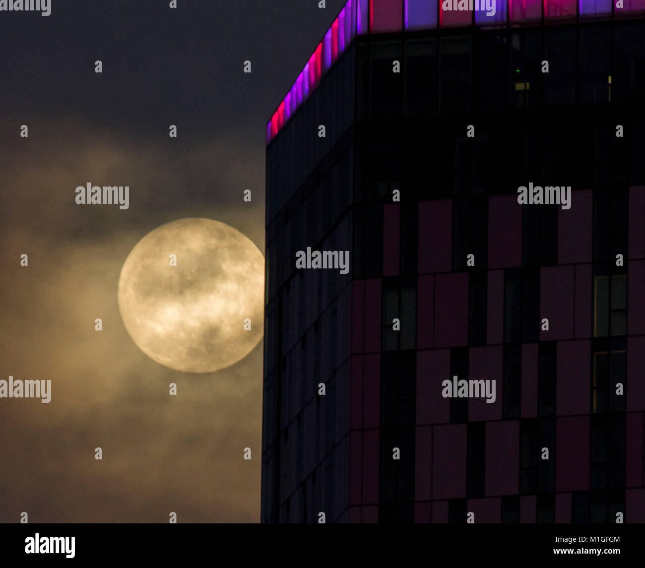 The moon rises behind the Saffron Square building in Croydon ahead of ...