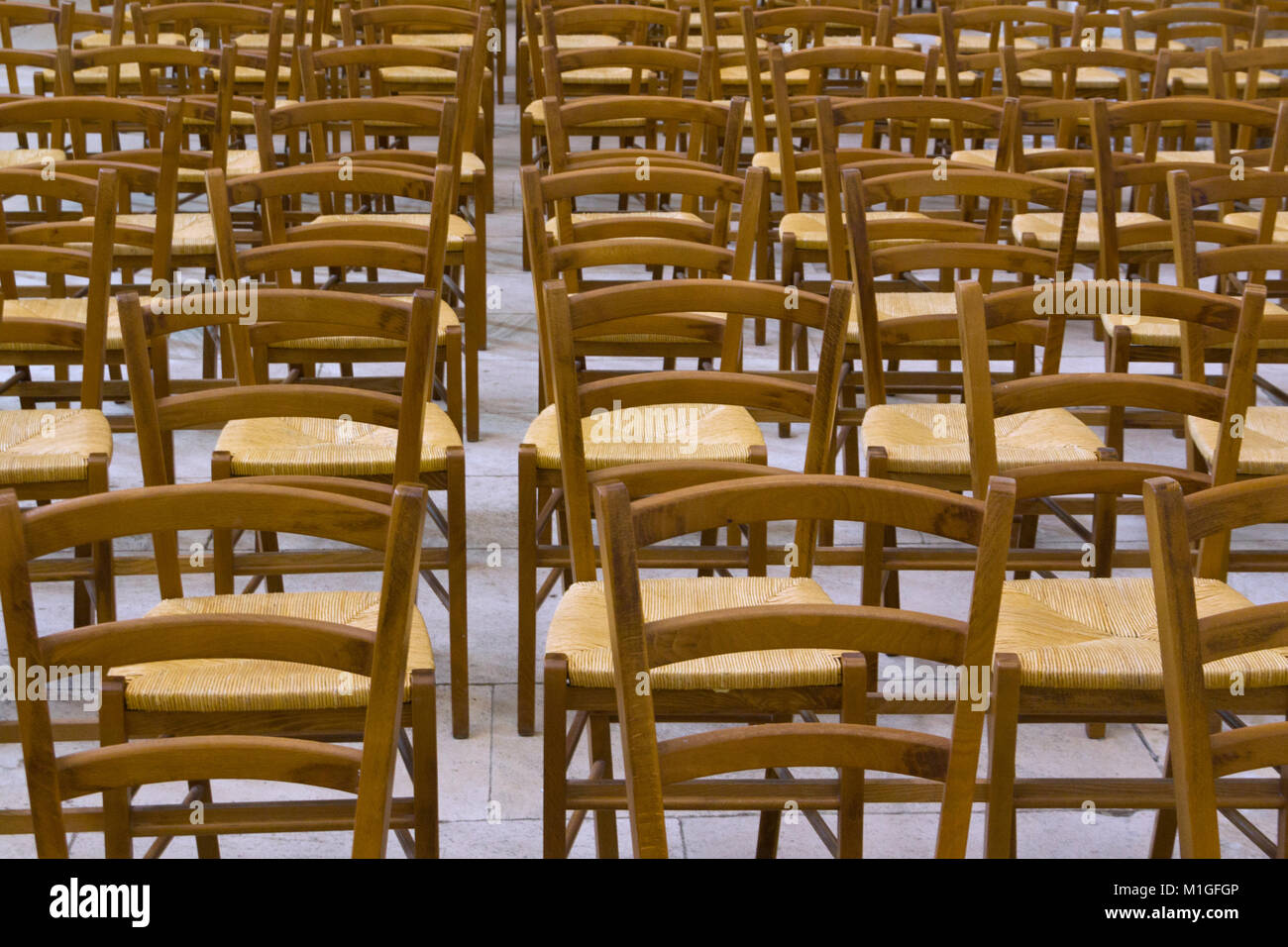 Many wooden chairs full frame pattern Stock Photo - Alamy