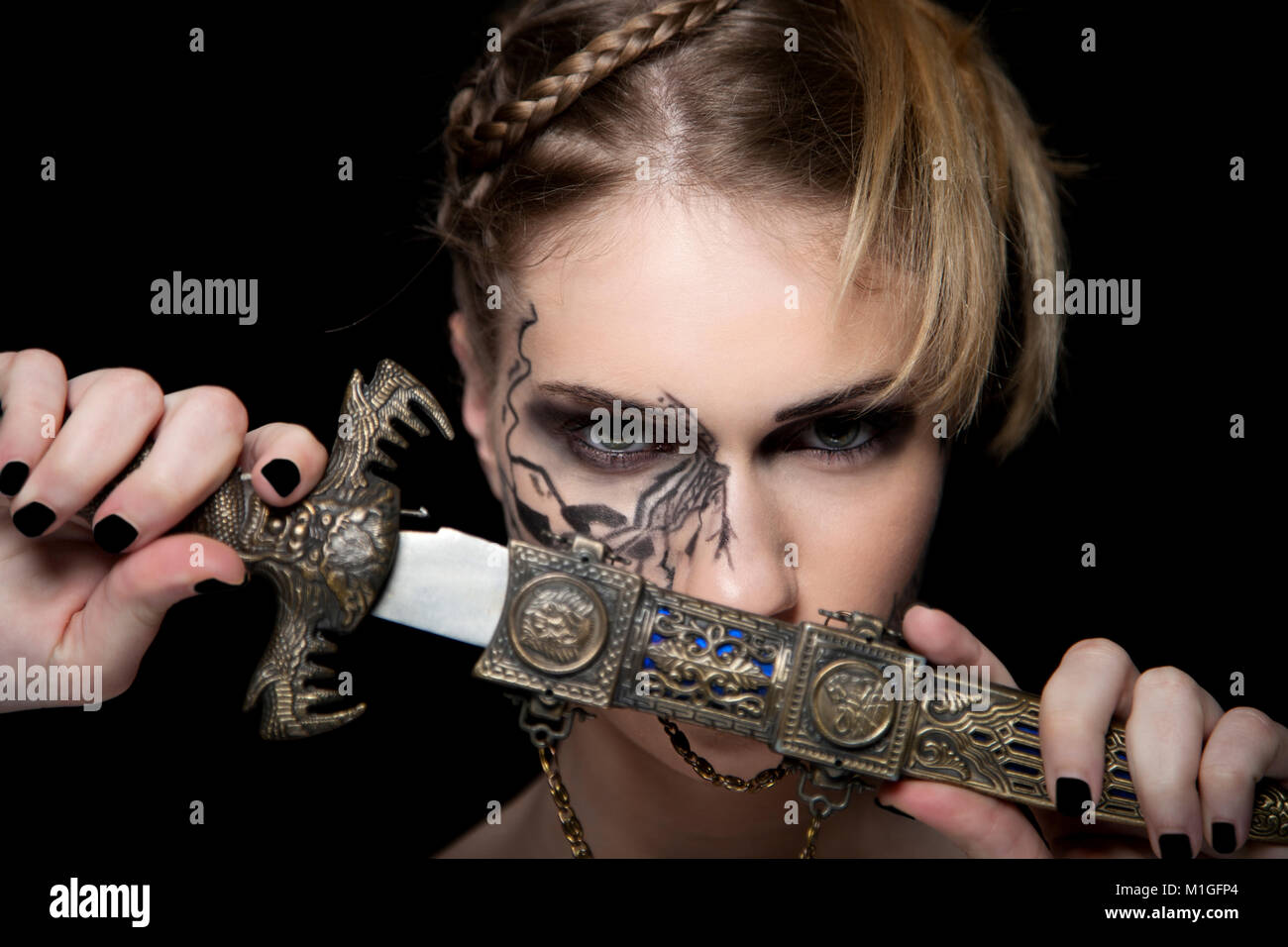 Warrior women with dagger Stock Photo - Alamy