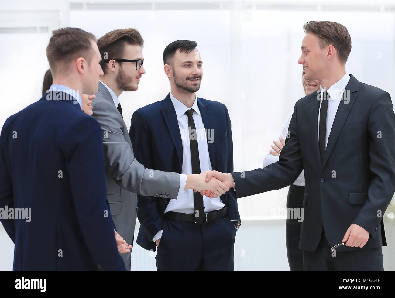 handshake Manager and the client in the office Stock Photo - Alamy