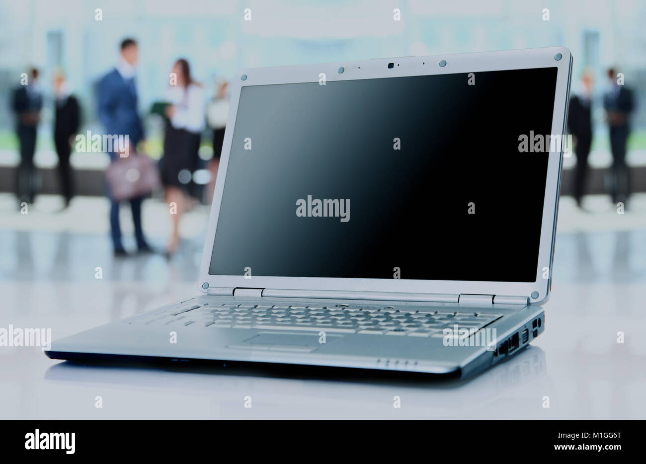 thin laptop on office desk Stock Photo - Alamy