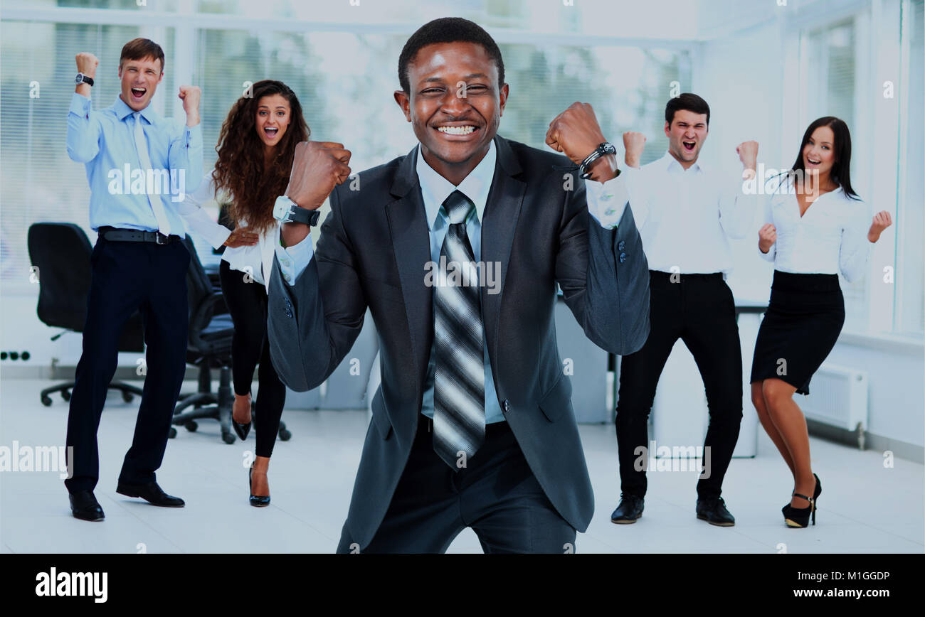 Business team celebrating a triumph with arms up Stock Photo - Alamy