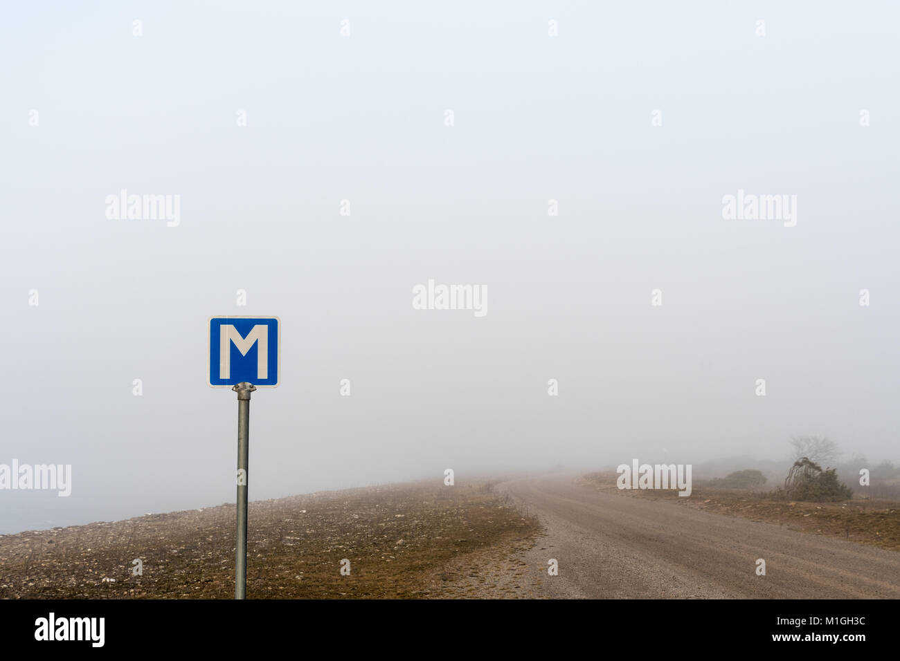 Passing place road sign by a country road in a misty landscape Stock ...