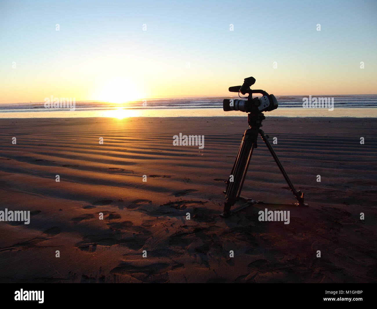 Digital Video Camera on beach during sunset Stock Photo - Alamy