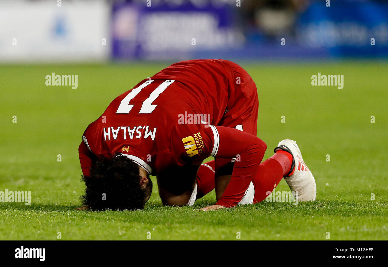 Liverpool's Mohamed Salah celebrates scoring his side's third goal of ...