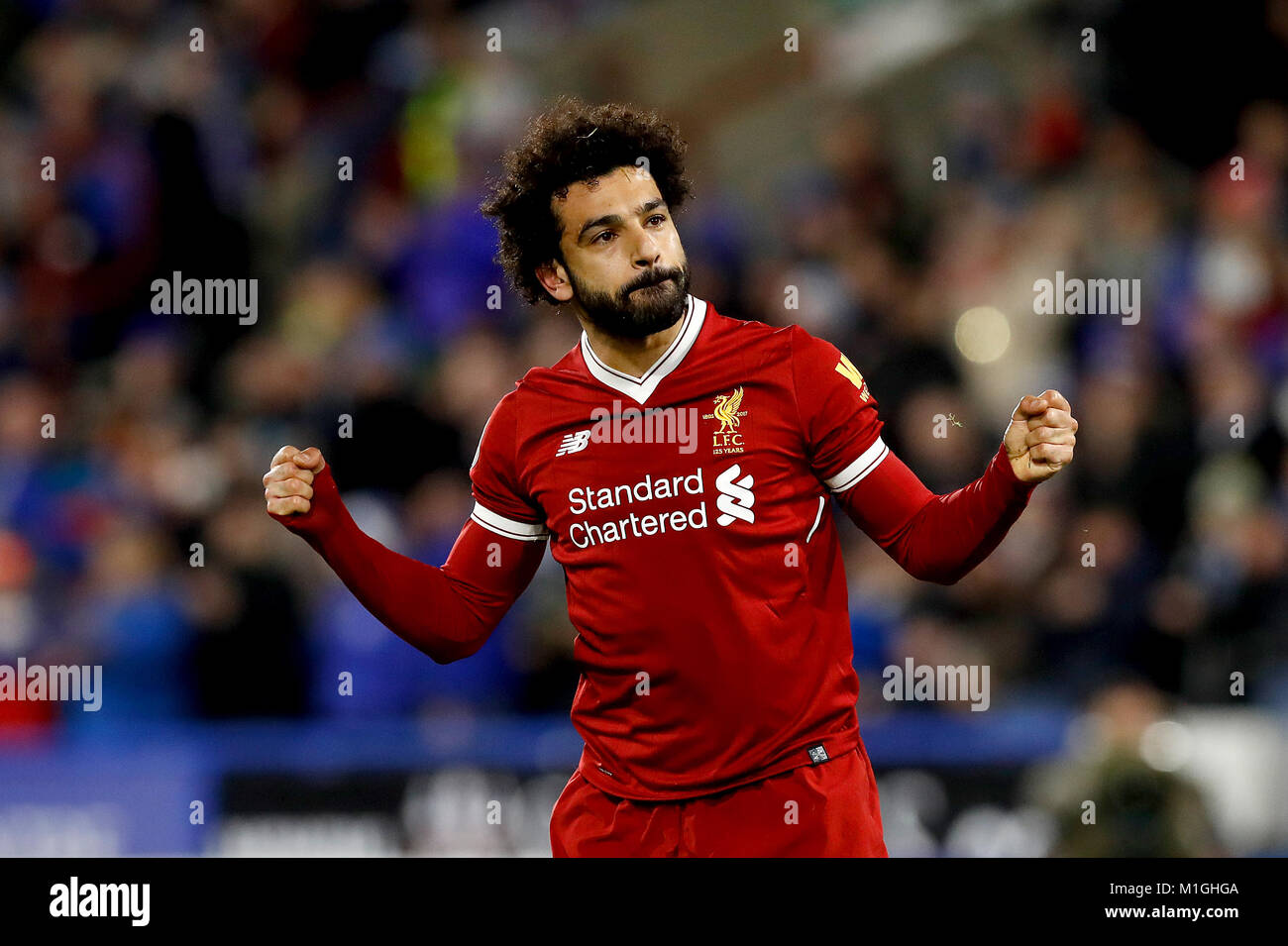 Liverpool's Mohamed Salah celebrates scoring his side's third goal of ...