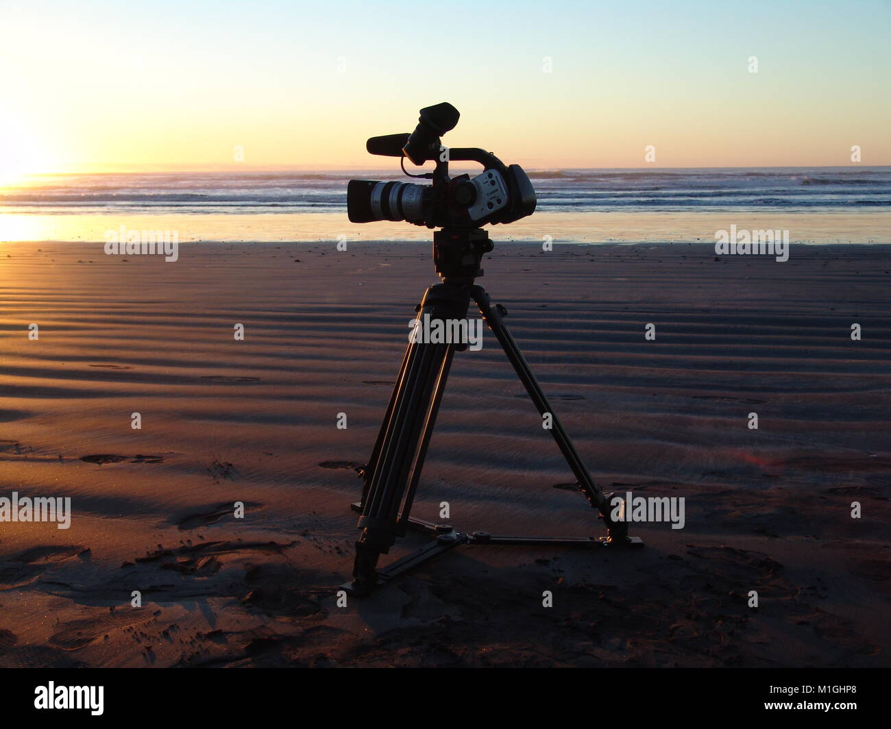 Digital Video Camera on beach during sunset Stock Photo - Alamy