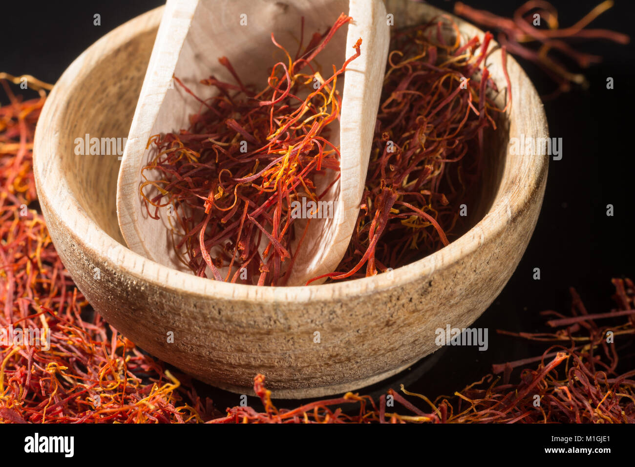 Macro collection, expensive real dried saffron spice close up on black ...